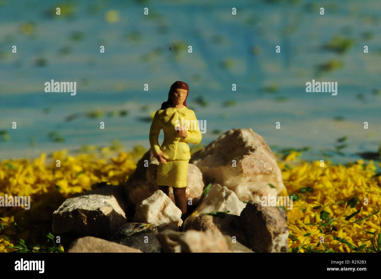 miniature figures woman and man taking fotos at the lake Stock Photo ...