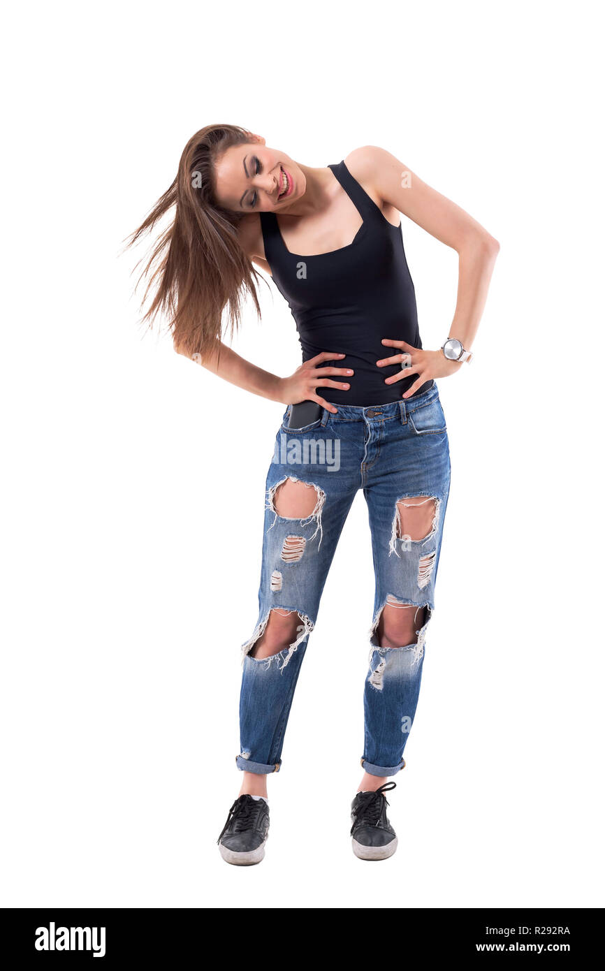 Motion of beautiful young fashion model tossing her brown long flowing ...