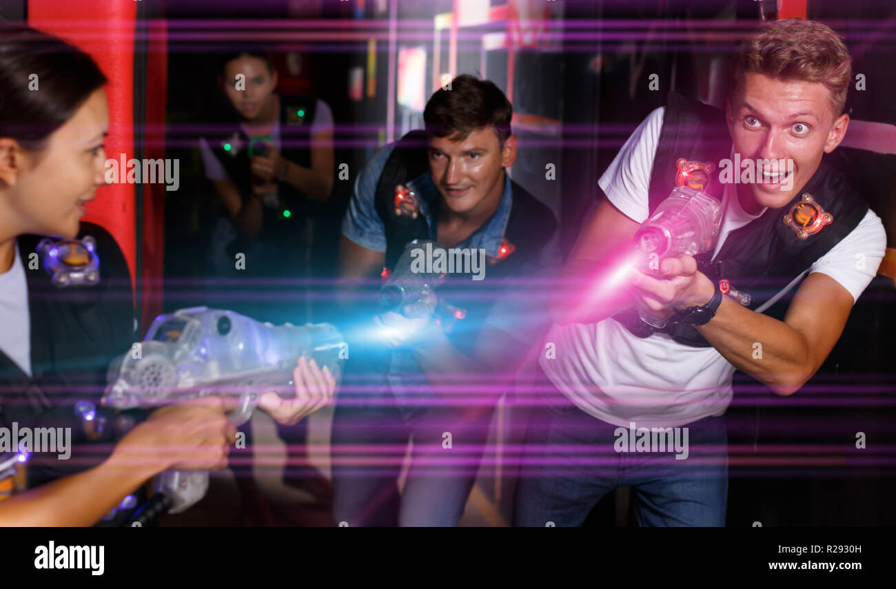 Adult man with laser guns took aim and having fun with friends during ...