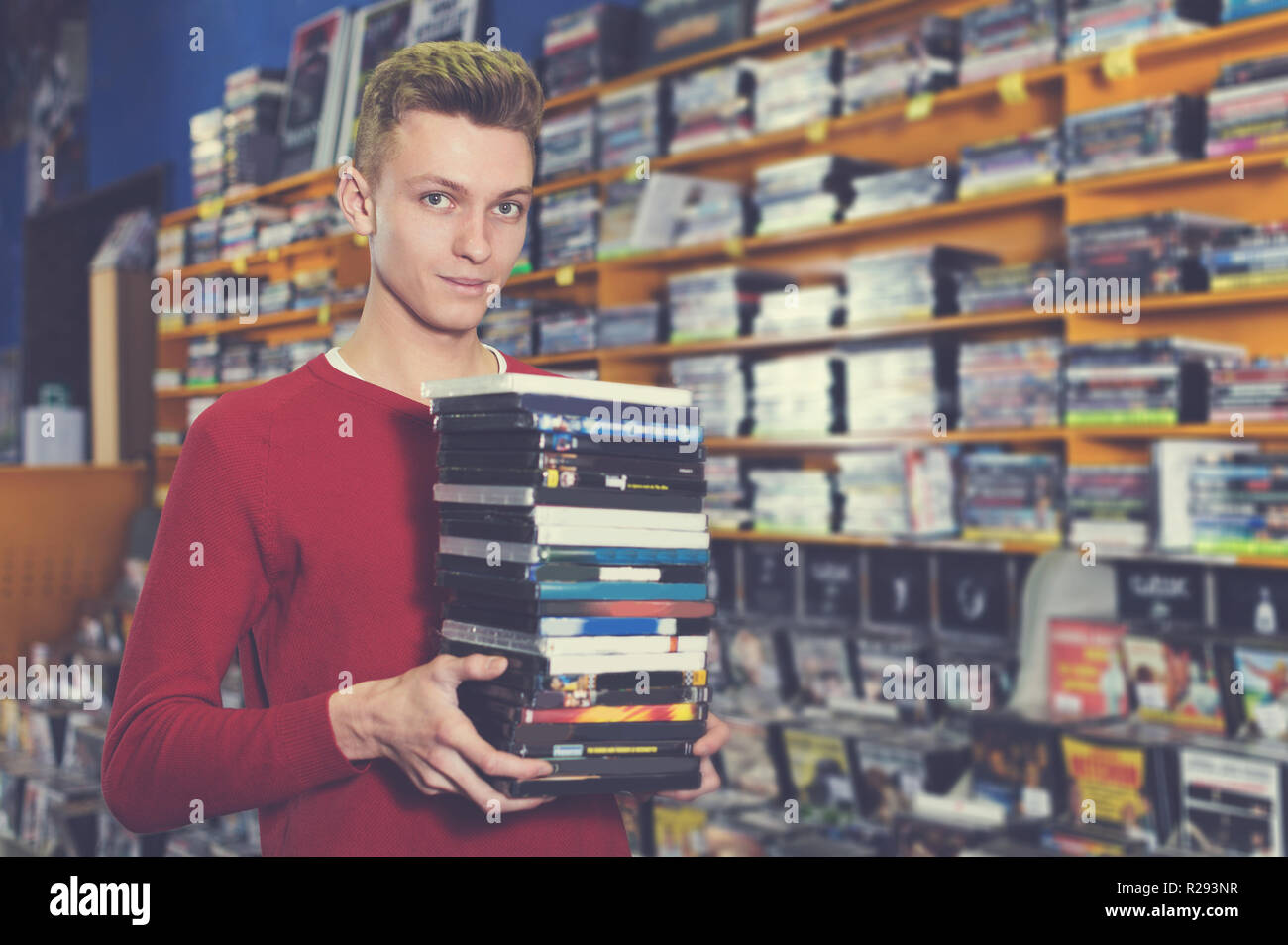 Man holding stack of dvds hi-res stock photography and images - Alamy