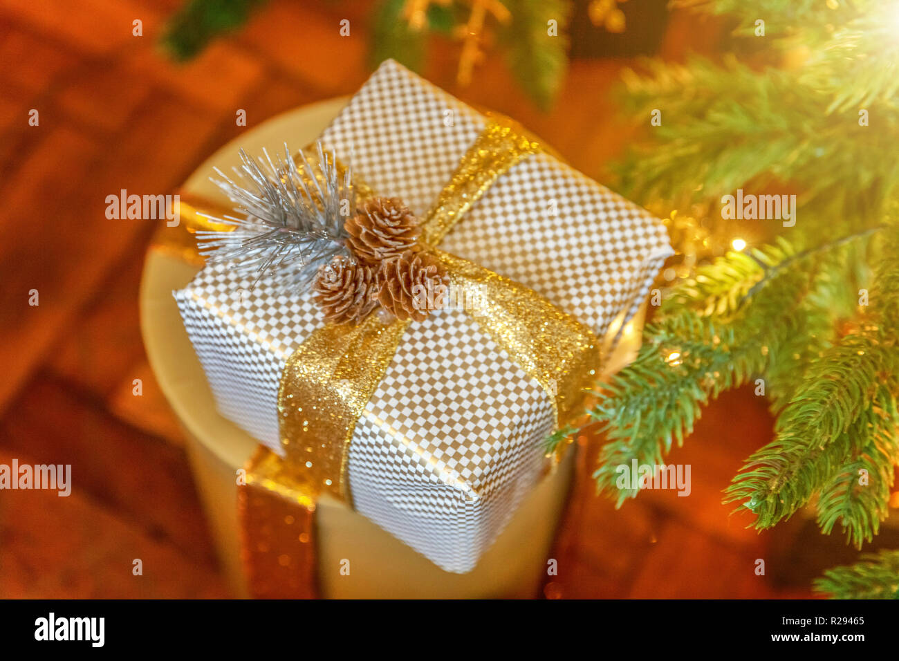 Classic Christmas decorated New year gold paper gift box with golden ...