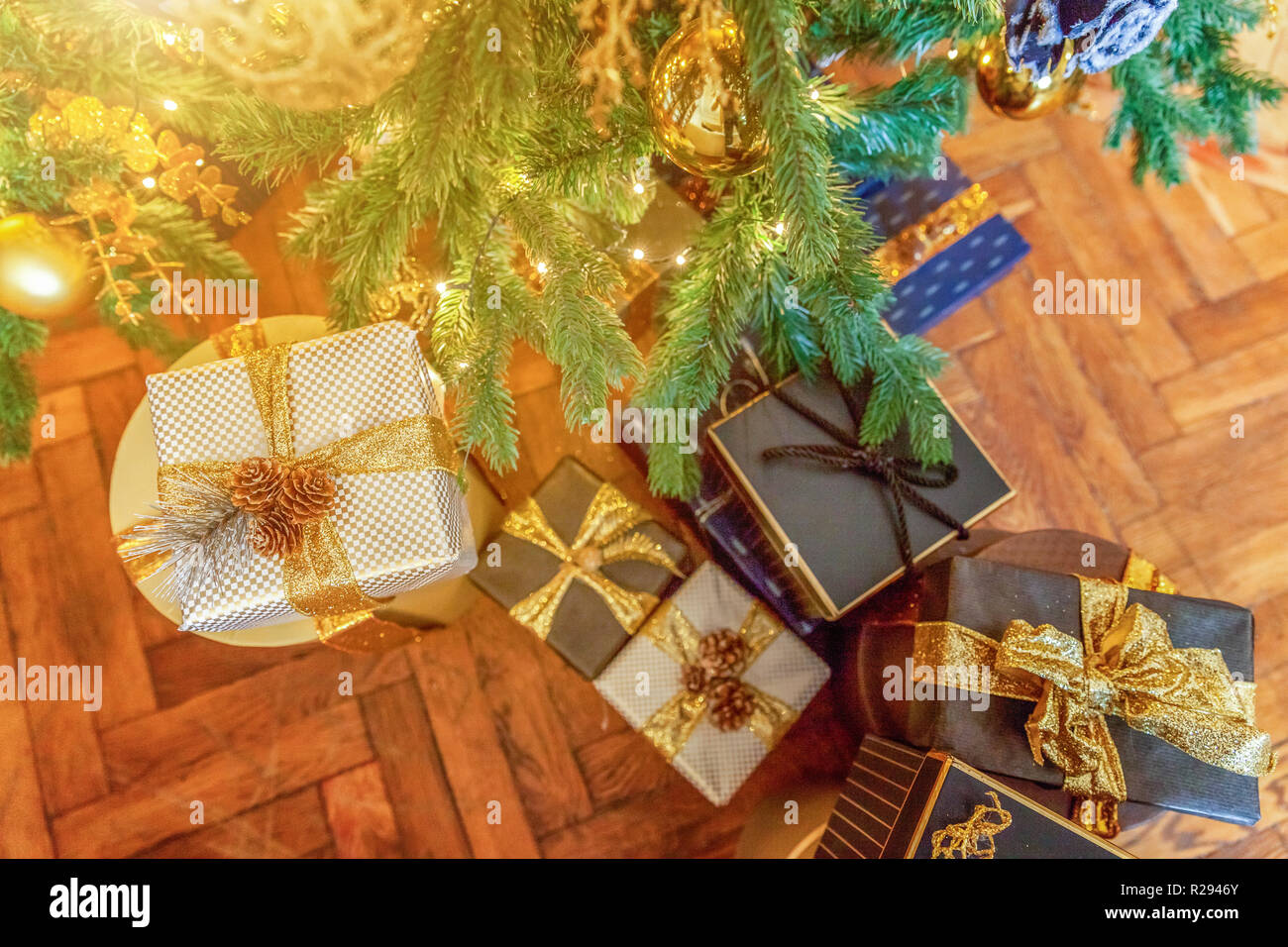 Classic Christmas decorated New year gold paper gift box with golden ...