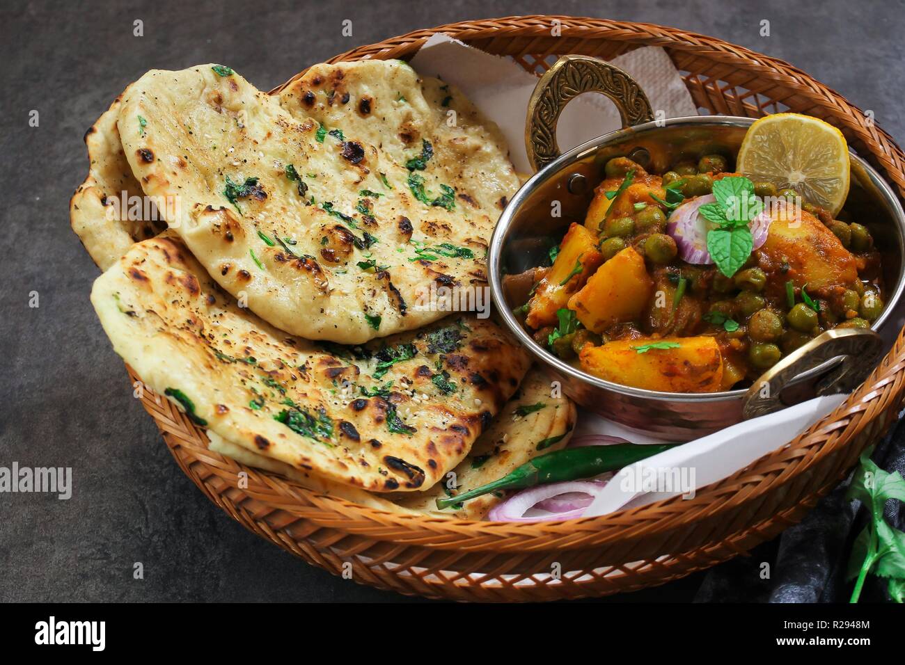 Homemade Kulcha / Indian flat bread Butter Naan served with Alu Matar ...