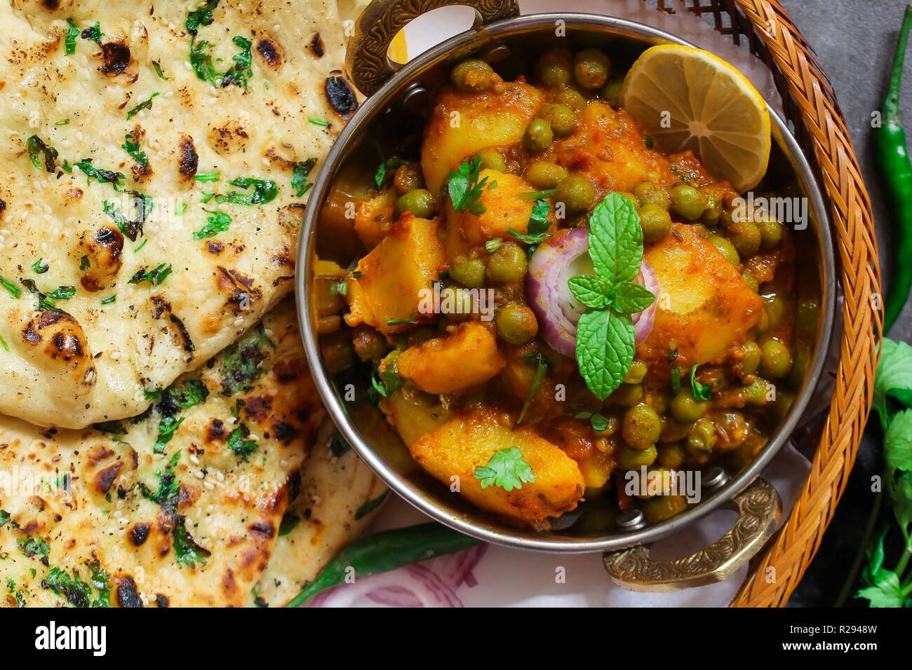 Homemade Kulcha / Indian flat bread Butter Naan served with Alu Matar ...