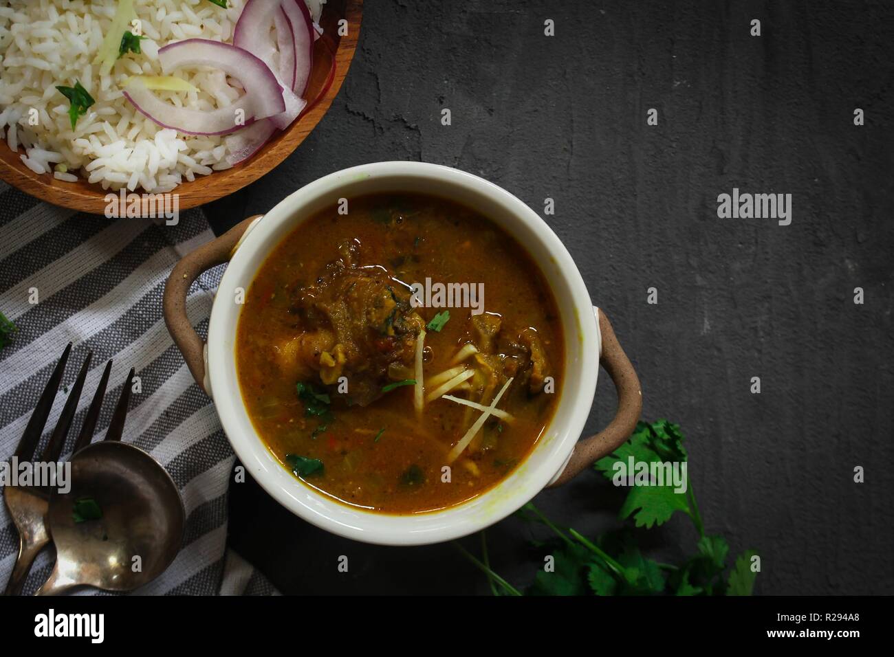 Chettinad Mutton Lamb curry served with rice, top view Stock Photo - Alamy