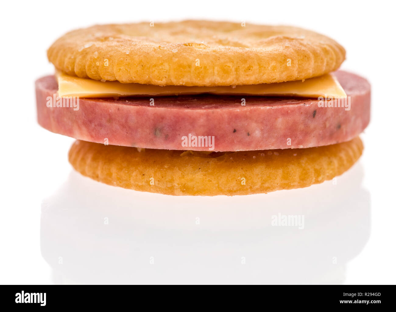 A cracker with summer sausage and cheese to make finger food ...
