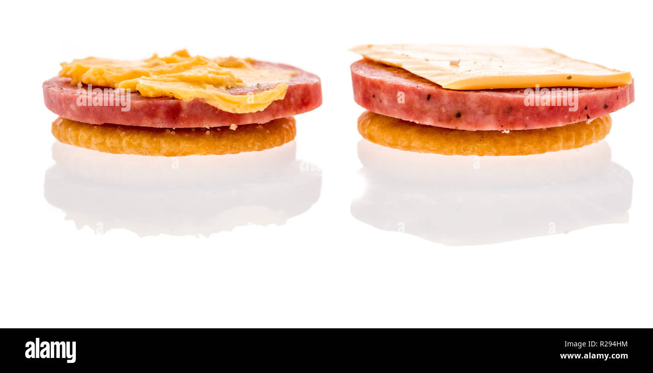 A cracker with summer sausage and cheese to make finger food ...