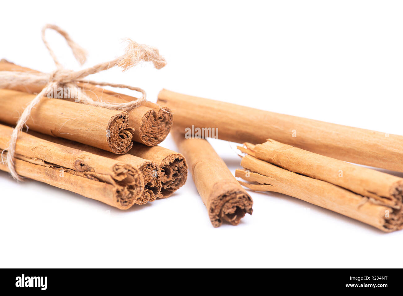 Cinnamon sticks tied with jute rope isolated on white background Stock ...