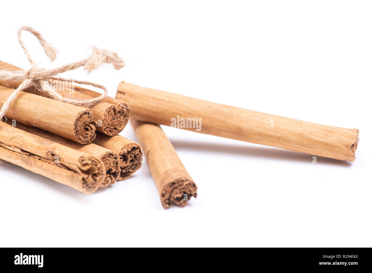 Cinnamon sticks tied with jute rope isolated on white background Stock ...