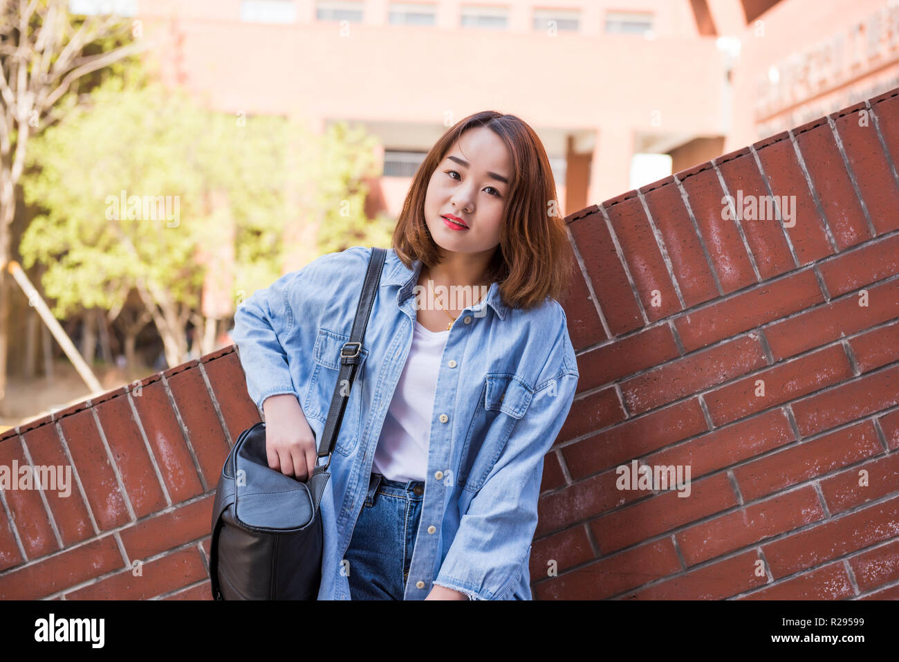 Girl student standing with backpack or school bag smiling happy ...