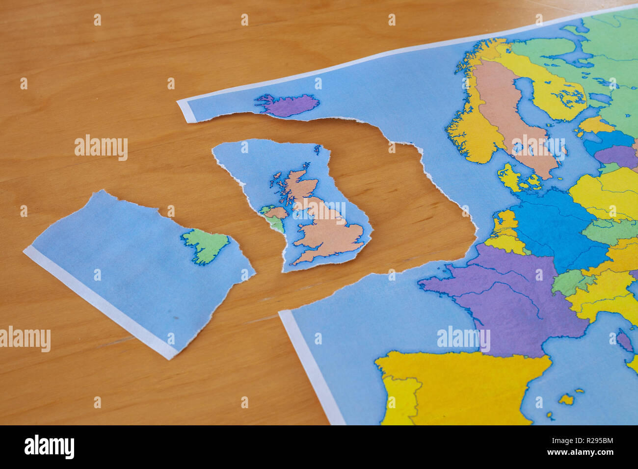 a torn paper map symbolizing the UK leaving the European Union or ...