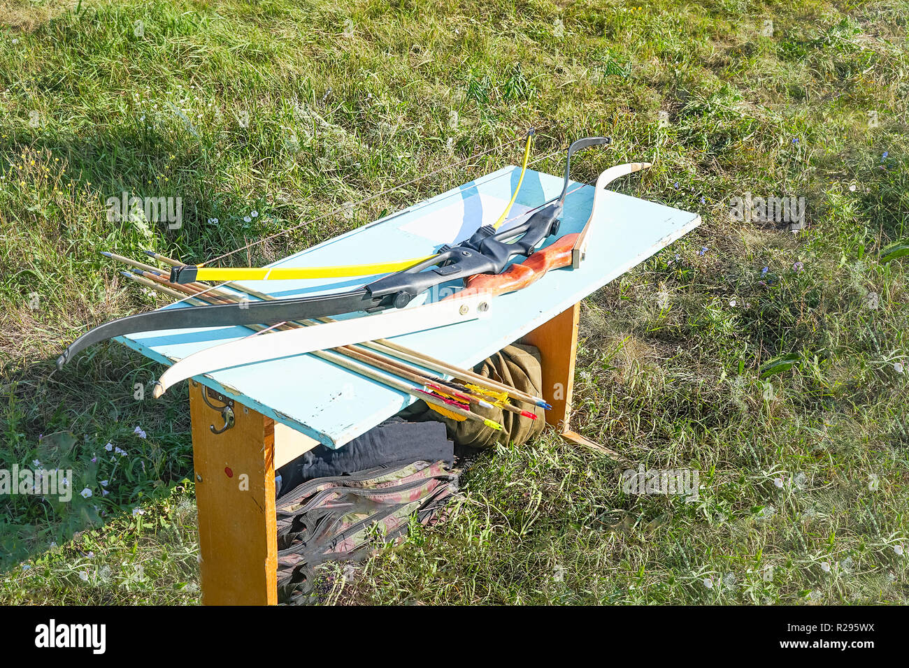 Archery and arrows on the table Stock Photo - Alamy
