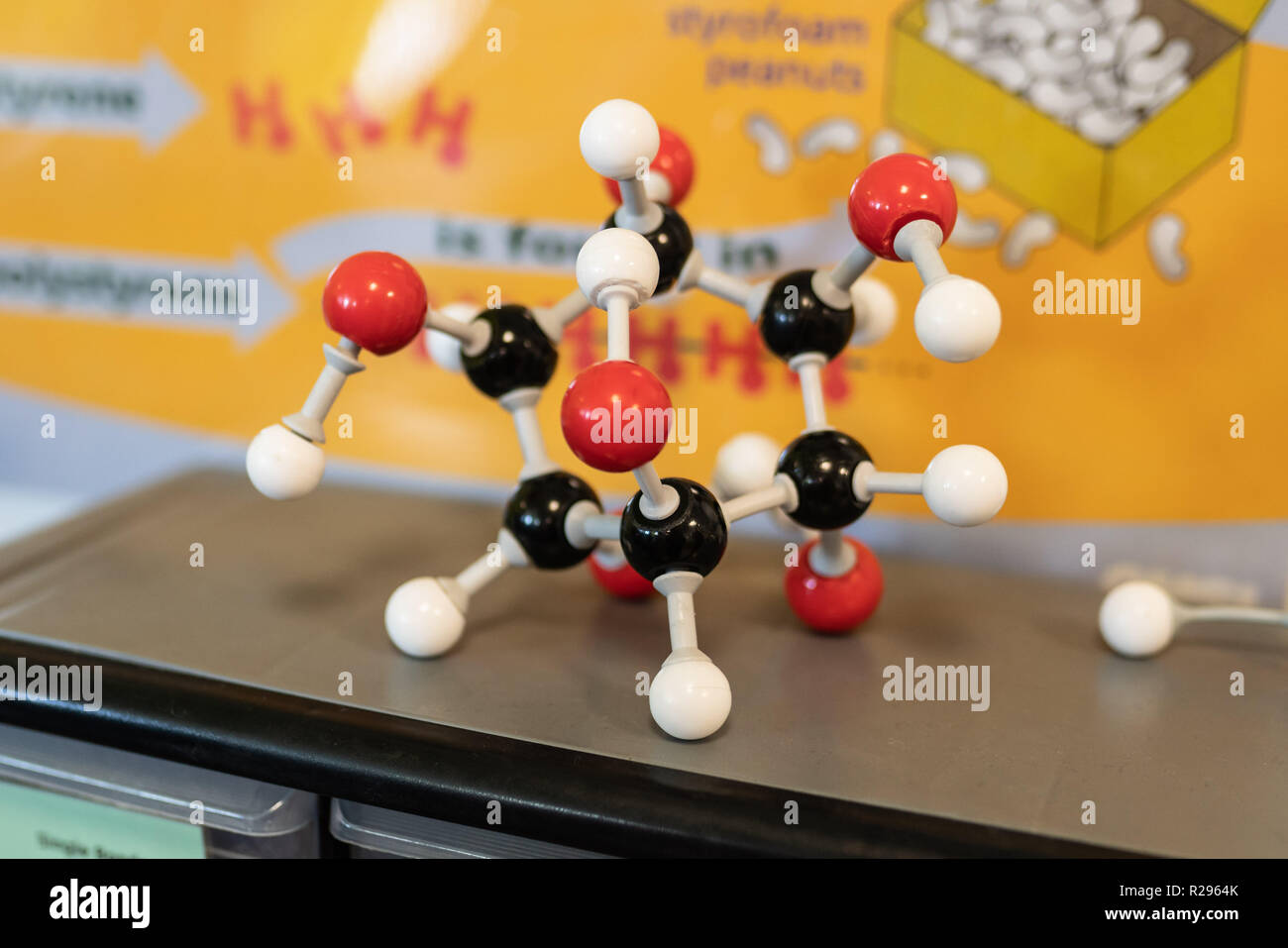 Complex molecule model made out of red, black and white construction ...