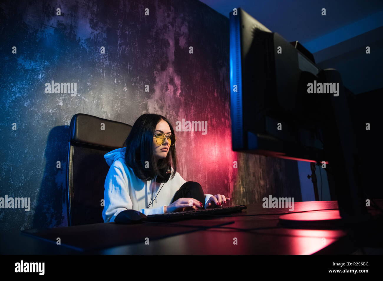 Portrait of the Beautiful Young Girl Sitting Before Computer, Browsing ...