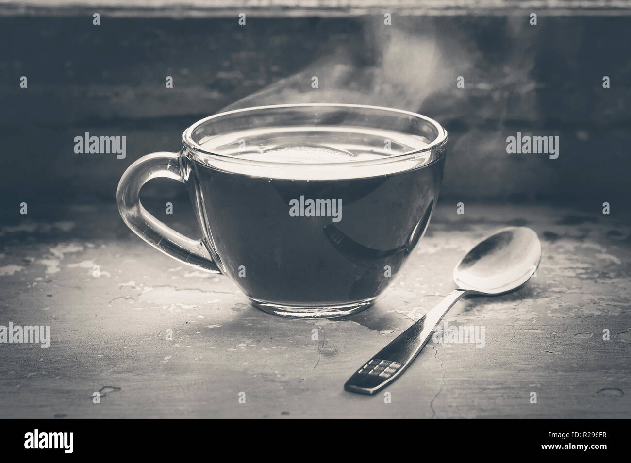 cup of hot black tea with steam on an old window sill Stock Photo - Alamy