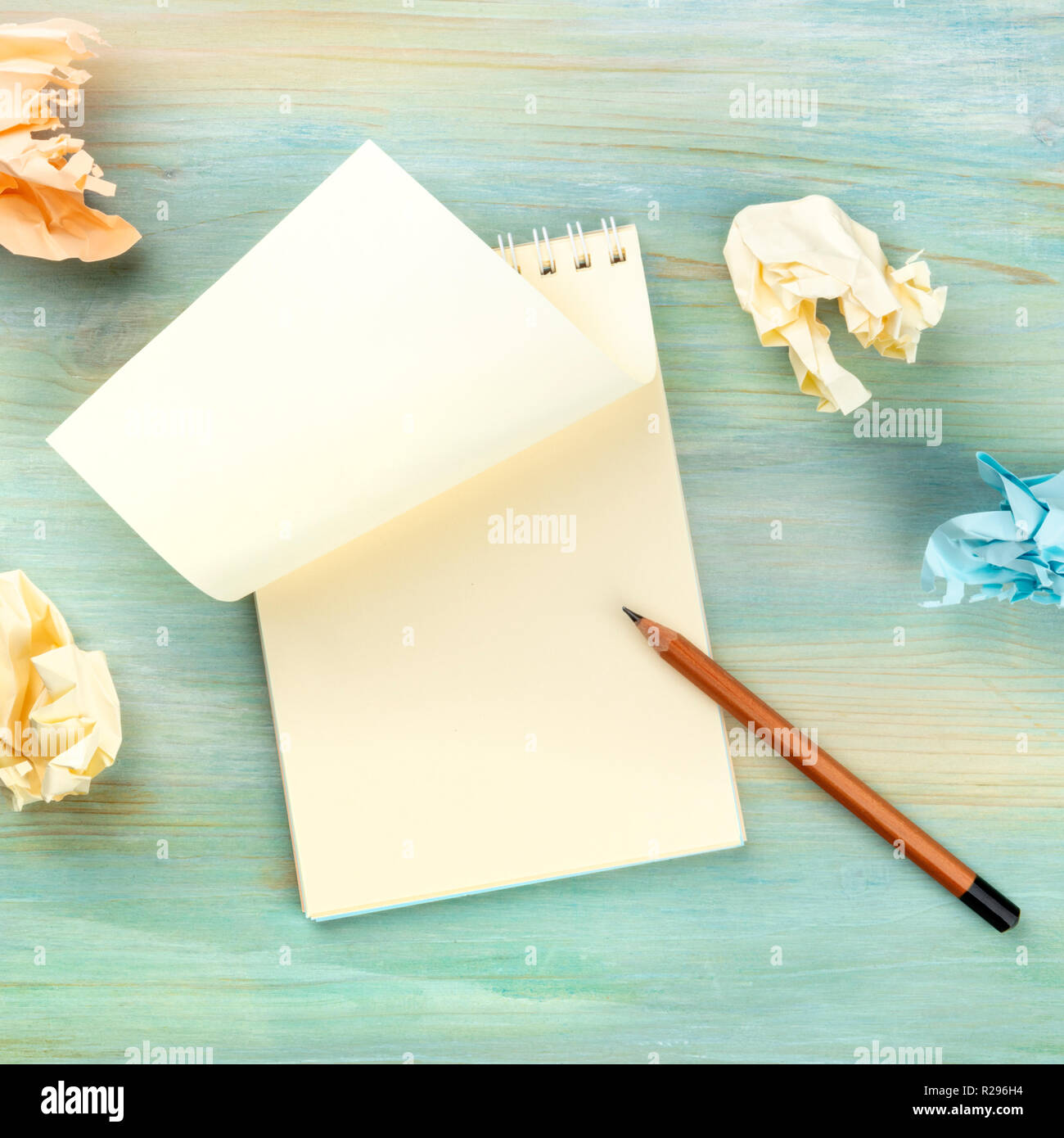 Inspiration Crisis. A spiral note pad with a blank sheet of paper and ...