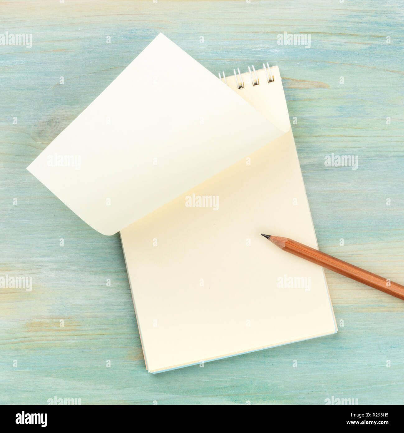 Turning a New Page. A spiral notepad with a blank sheet of paper, shot ...