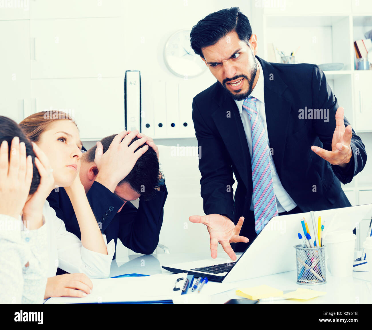 Businessman feeling angry to coworkers in office, pointing out mistakes ...