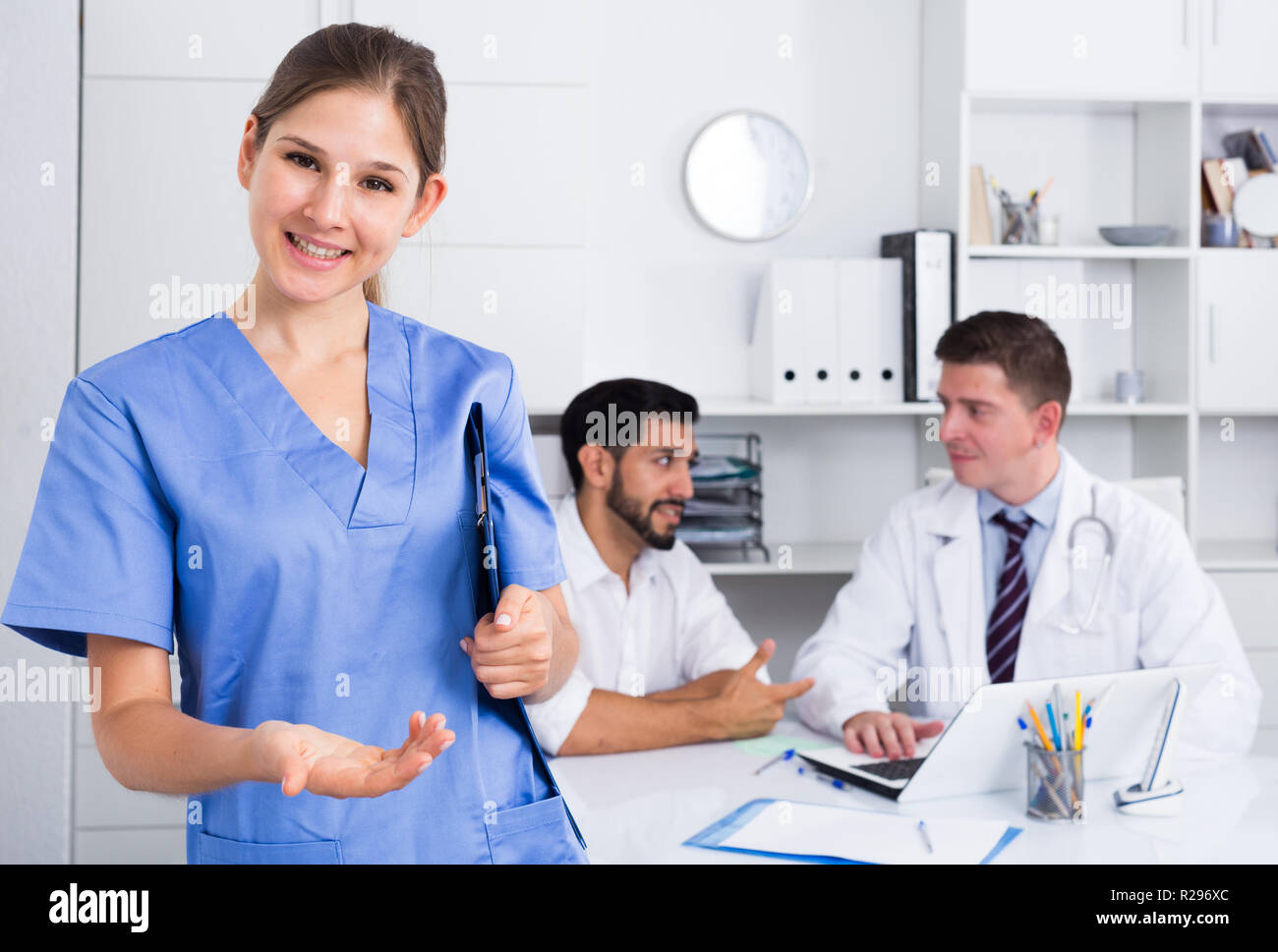 Portrait of young female doctor meeting patient in medical office Stock ...