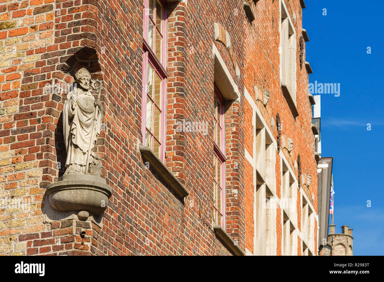 statue of Saint Nicholas on the gable of the brick house, Bruges ...