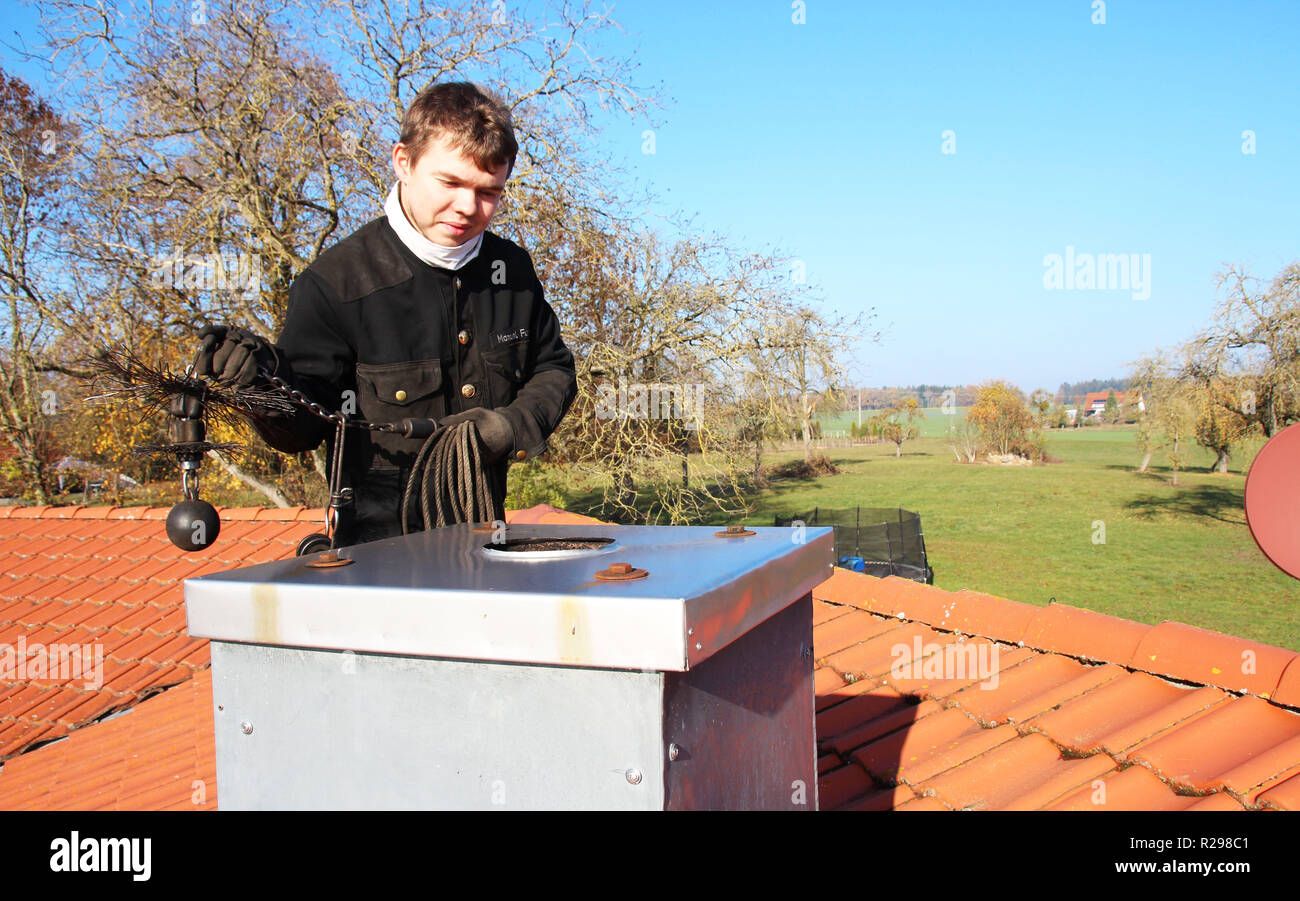 A Chimney sweeper working outdoors Stock Photo - Alamy