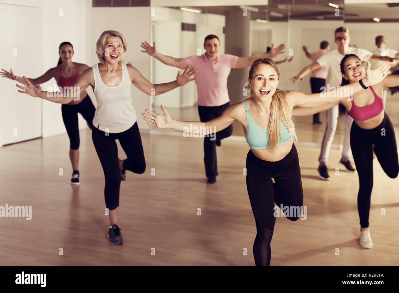 vigorous people dancing aerobics at lesson in the dance class Stock ...