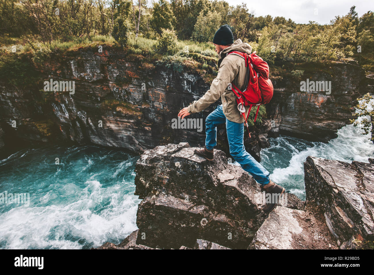 Man running cliff hi-res stock photography and images - Alamy