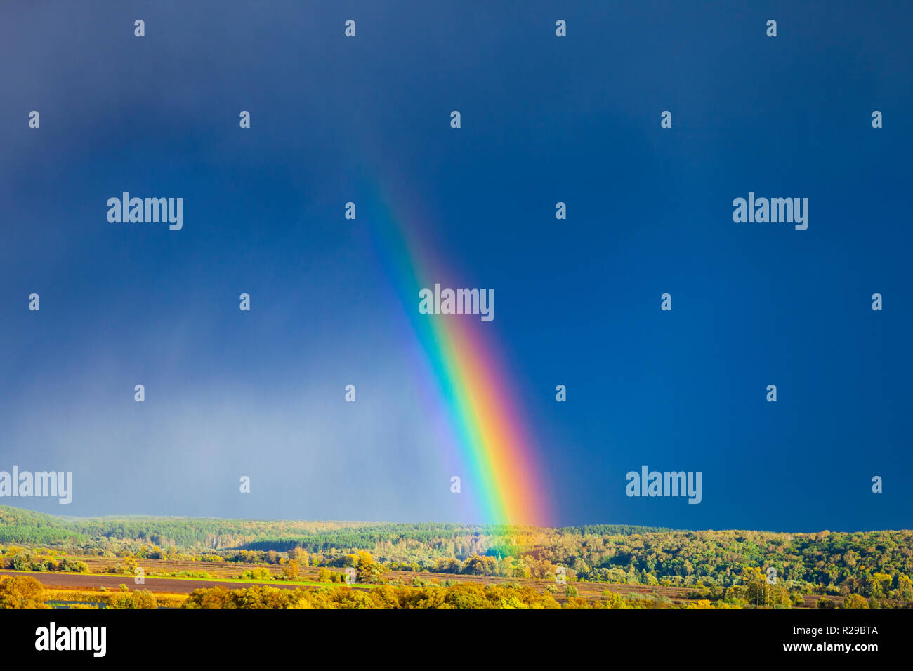 Blue sky with clouds on horizon and rainbow background hi-res stock ...