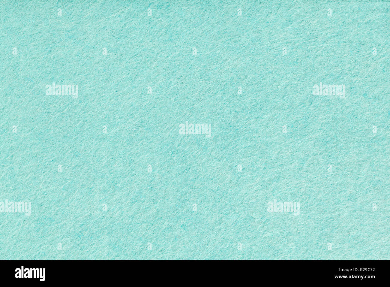 Light turquoise matte background of suede fabric, closeup. Velvet ...