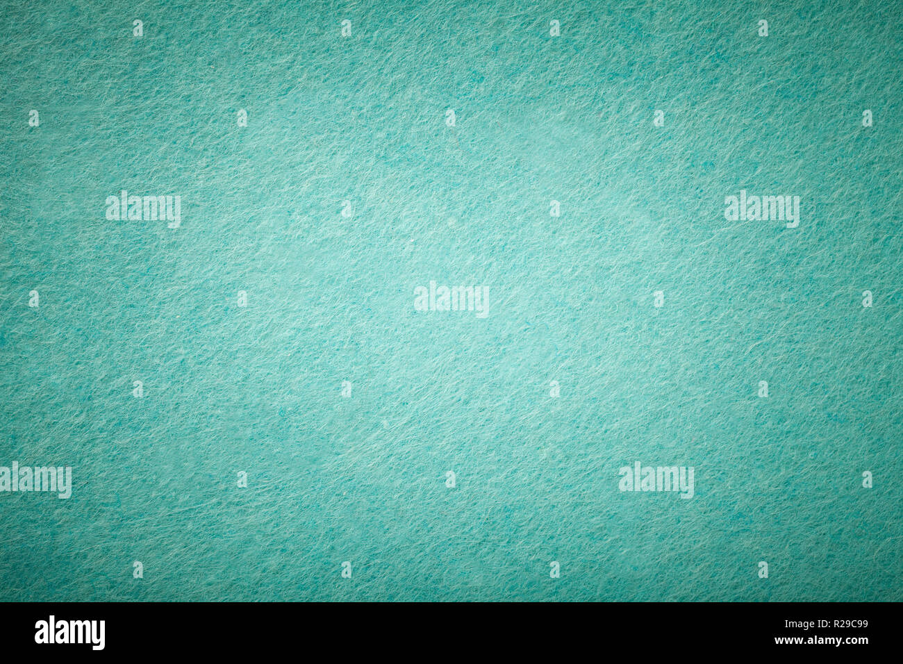 Light turquoise matte background of suede fabric, closeup. Velvet ...