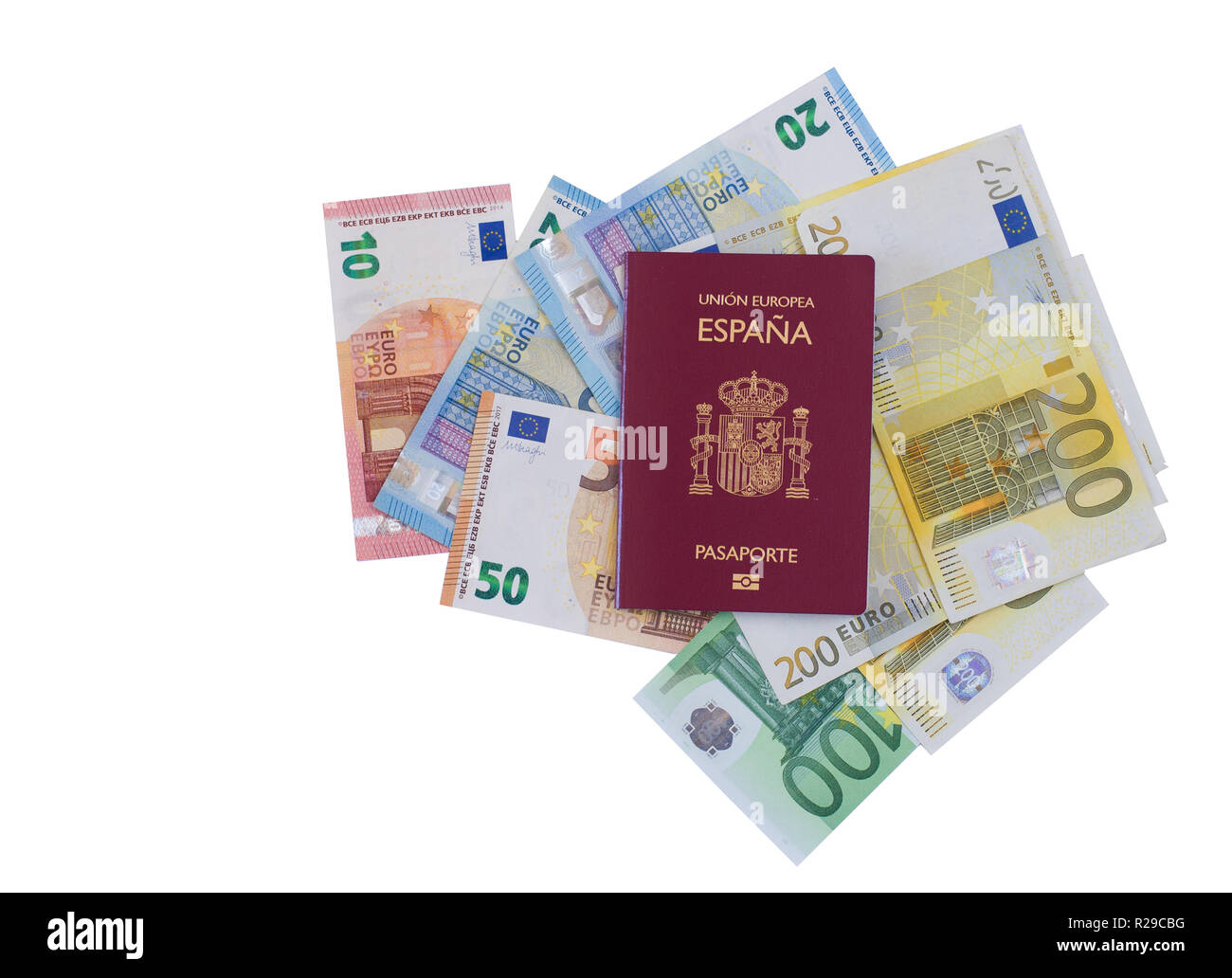 Different euro banknotes under a Spanish travel passport Stock Photo ...