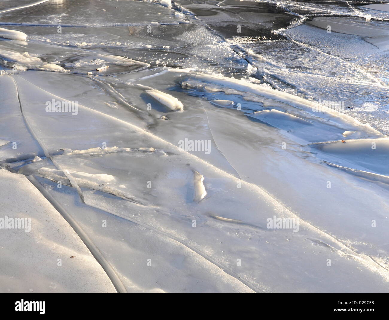 Cracks in the ice on a lake Stock Photo - Alamy