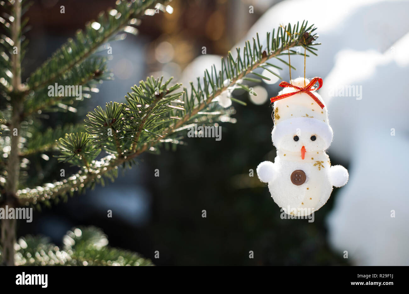 Snowman on fir branch Stock Photo - Alamy