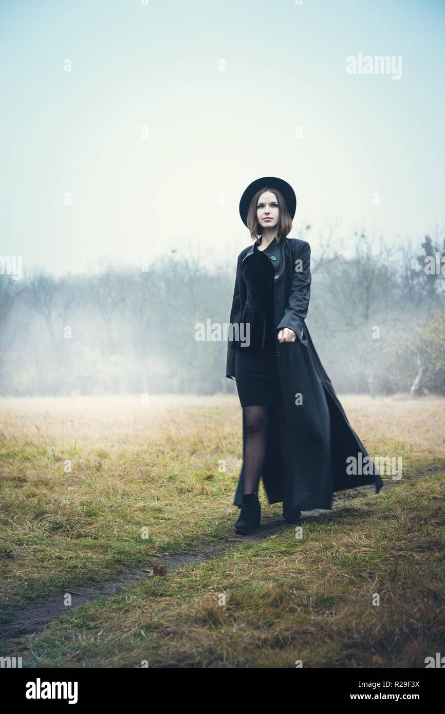 Silhouette woman coat walking hi-res stock photography and images - Alamy