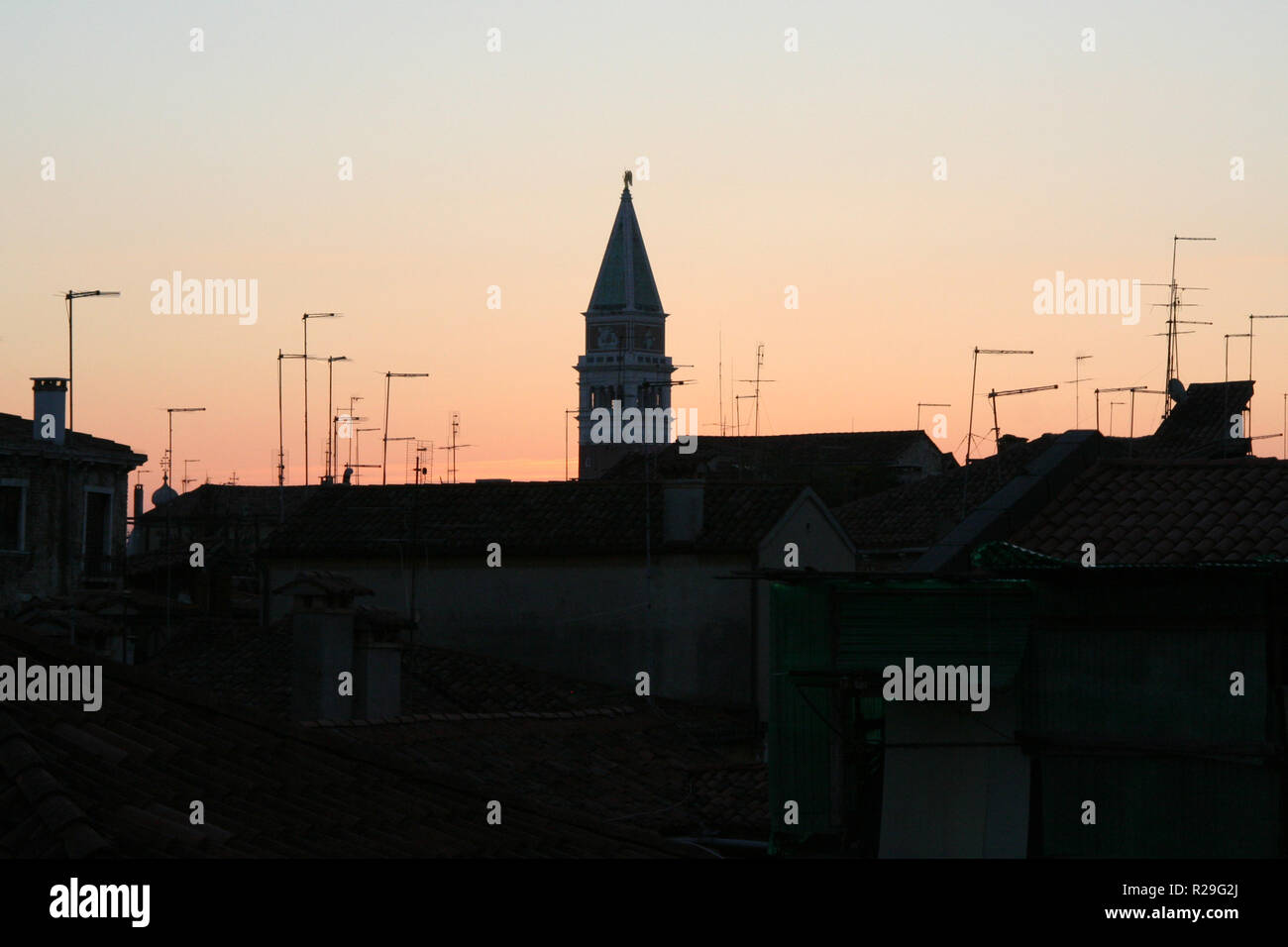 Venice, San Marco bell tower between the roofs, at dawn Stock Photo - Alamy