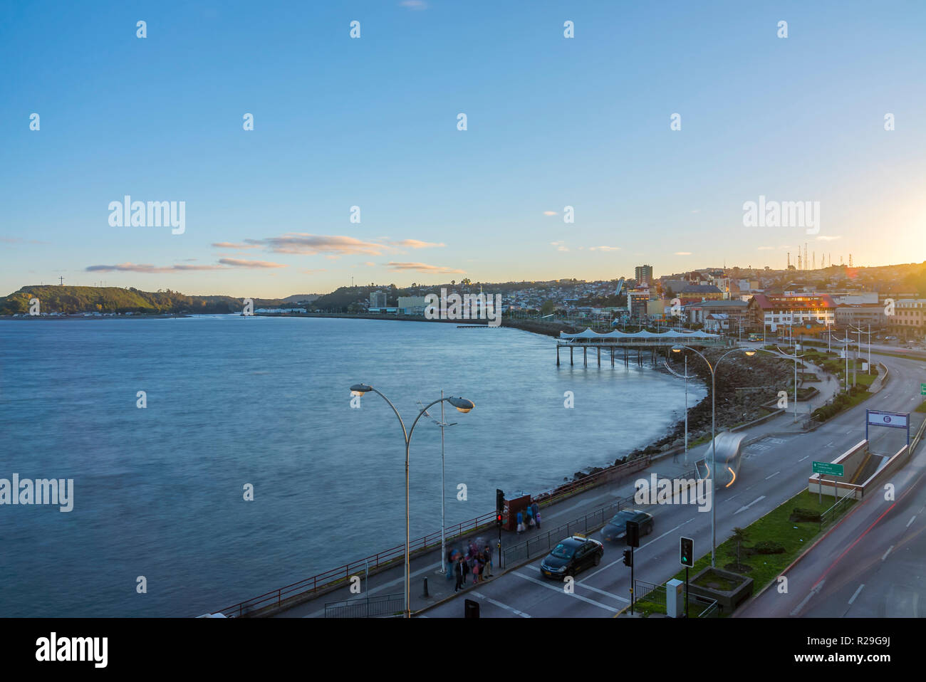 Landscape of the waterfront of Puerto Montt at sunset, an autumn day ...
