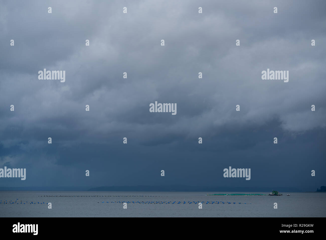 Stormy rain clouds over sea hi-res stock photography and images - Alamy