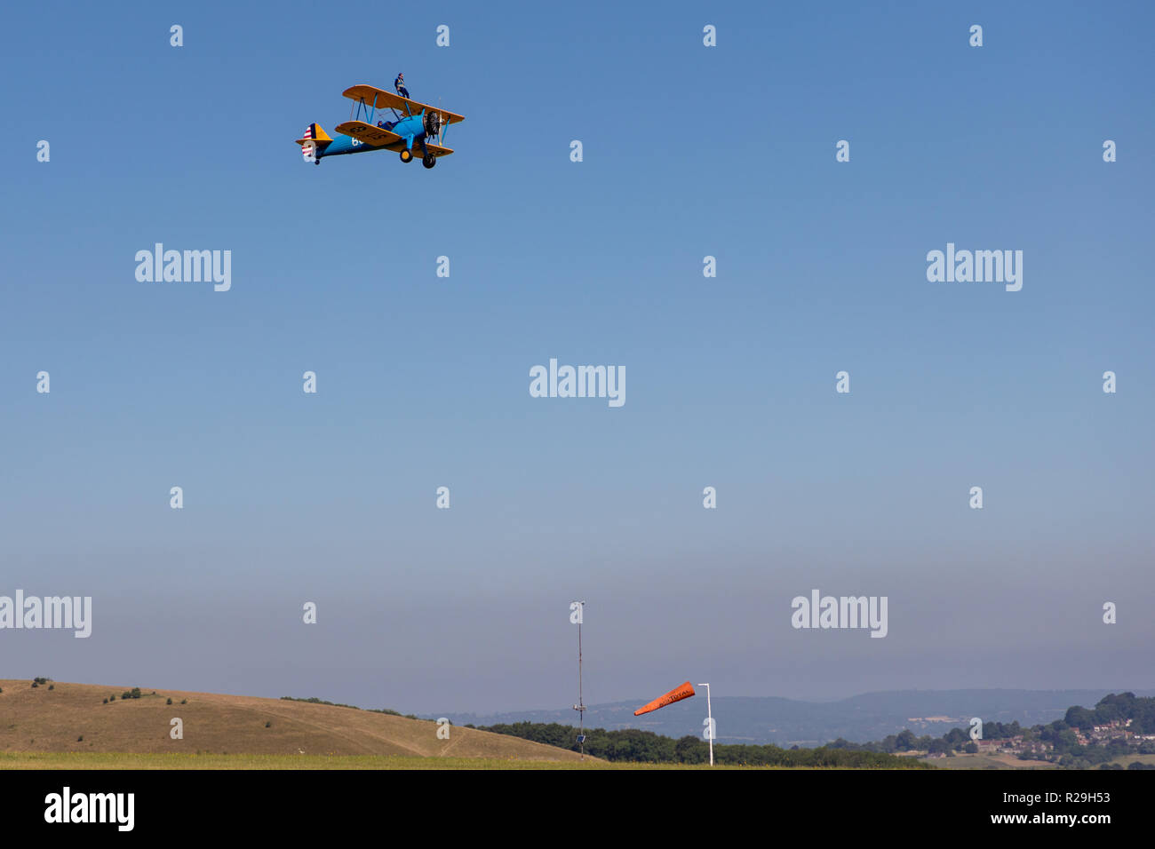 Wing walking on bi plane on summers day Stock Photo - Alamy