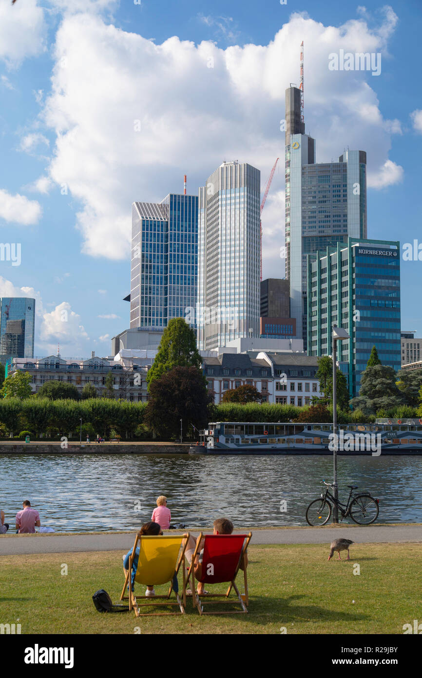 People relaxing along River Main, Frankfurt, Hesse, Germany Stock Photo ...