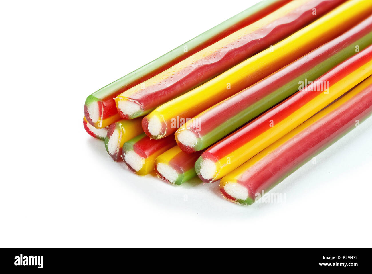 Multicolored candy strips isolated on white background. space for text ...