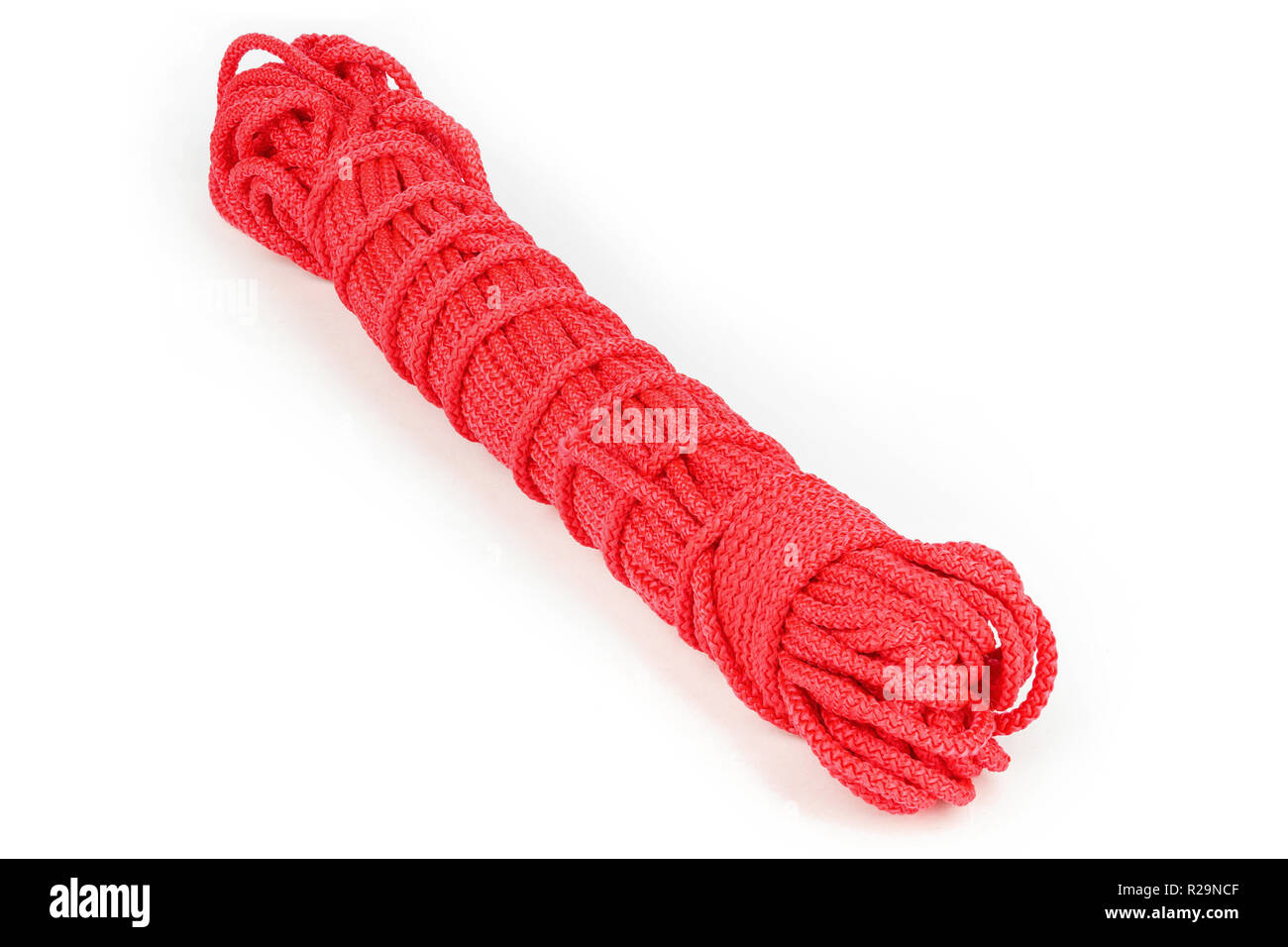 reeled up red nylon rope isolated on white background Stock Photo - Alamy