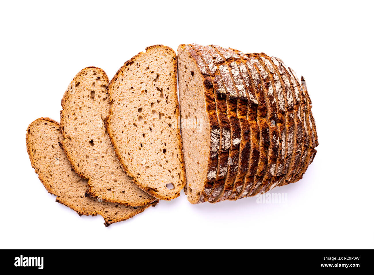 Loaf and slices of bread isolated on white background, view directly ...
