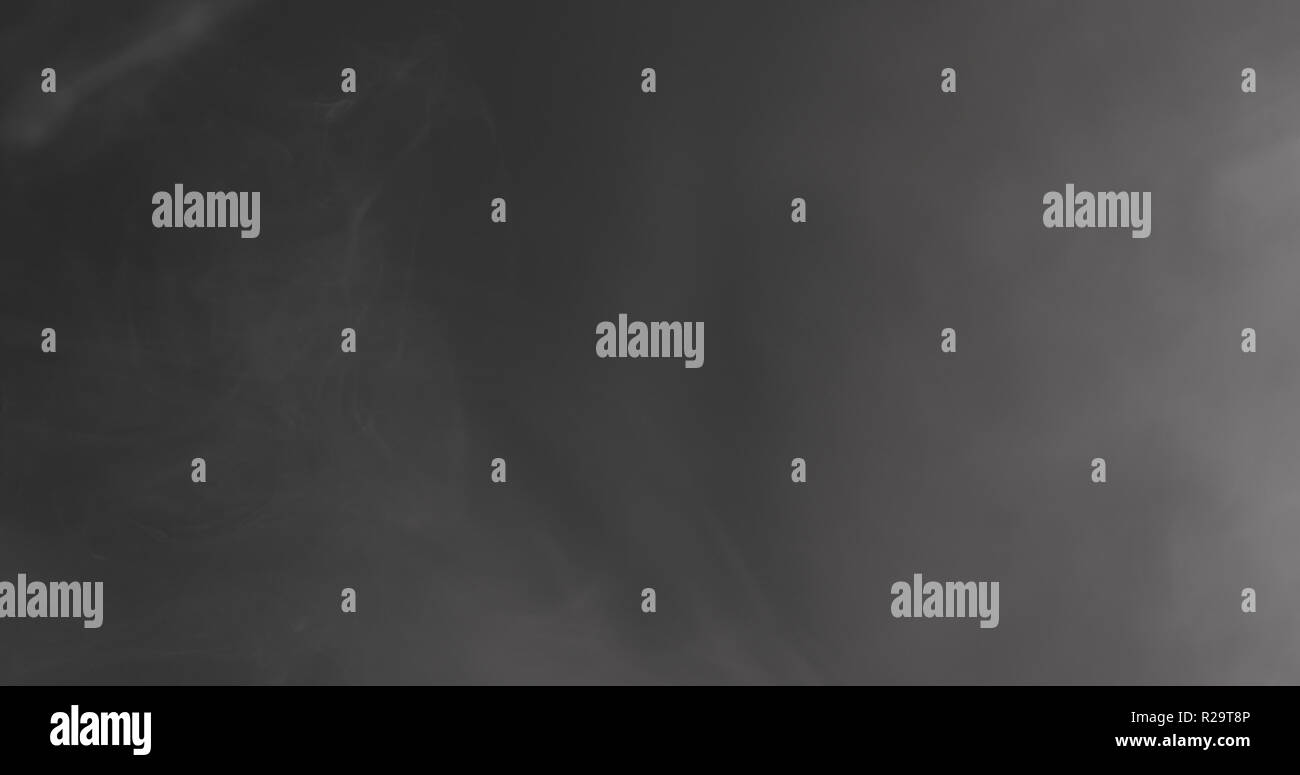 Slow motion closeup vapor floating in air on black background, wide ...
