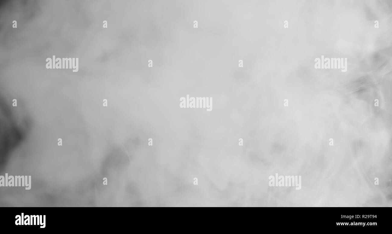 Slow motion closeup vapor floating in air on black background, wide ...