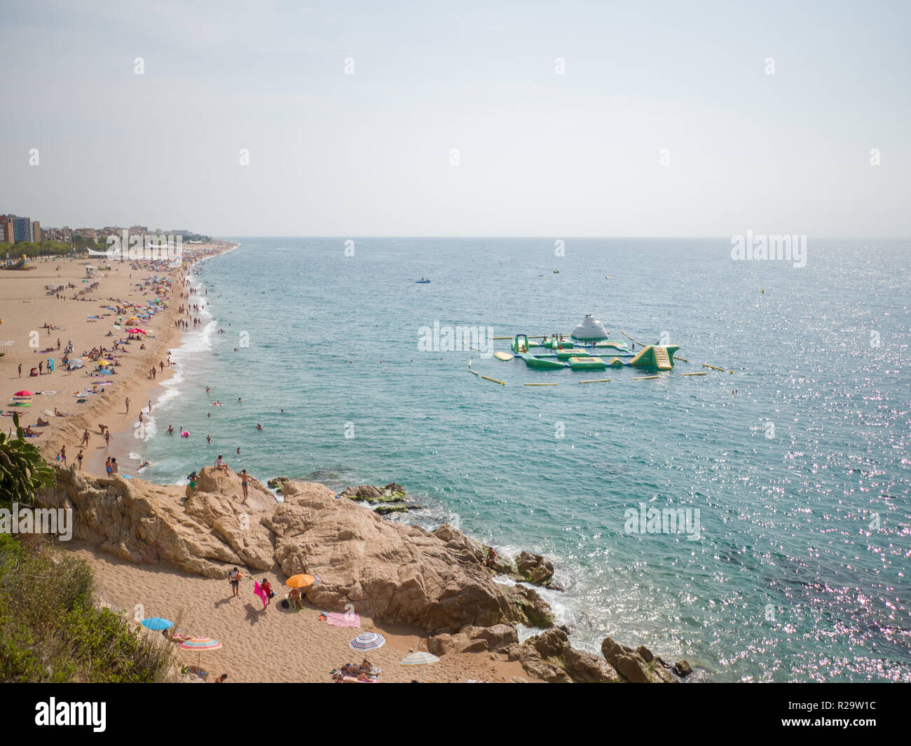 People at beach in Calella city. Spain Stock Photo - Alamy