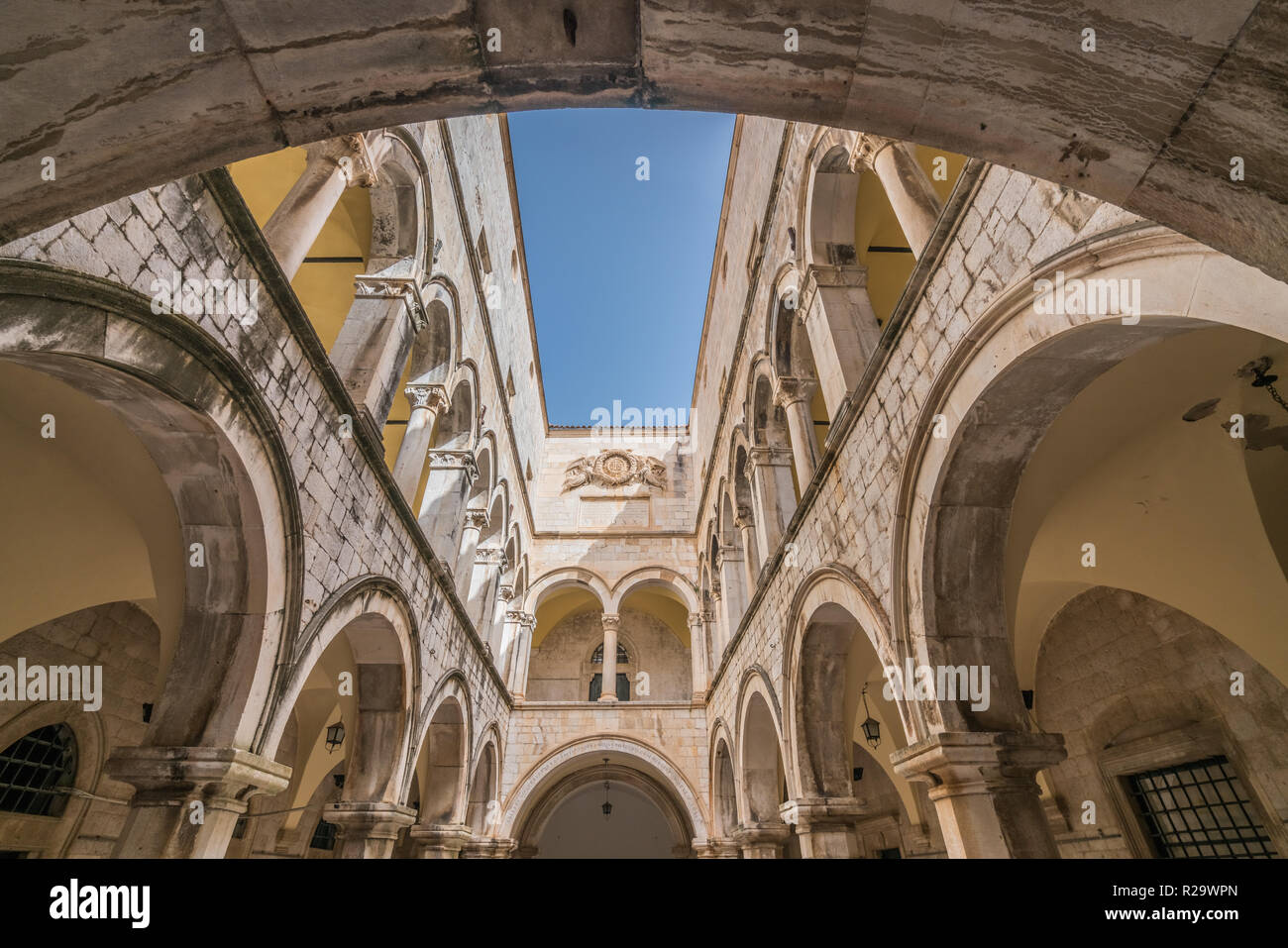 Arched inner courtyard in Sponza Palace in Dubrovnik Old Town, Croatia ...