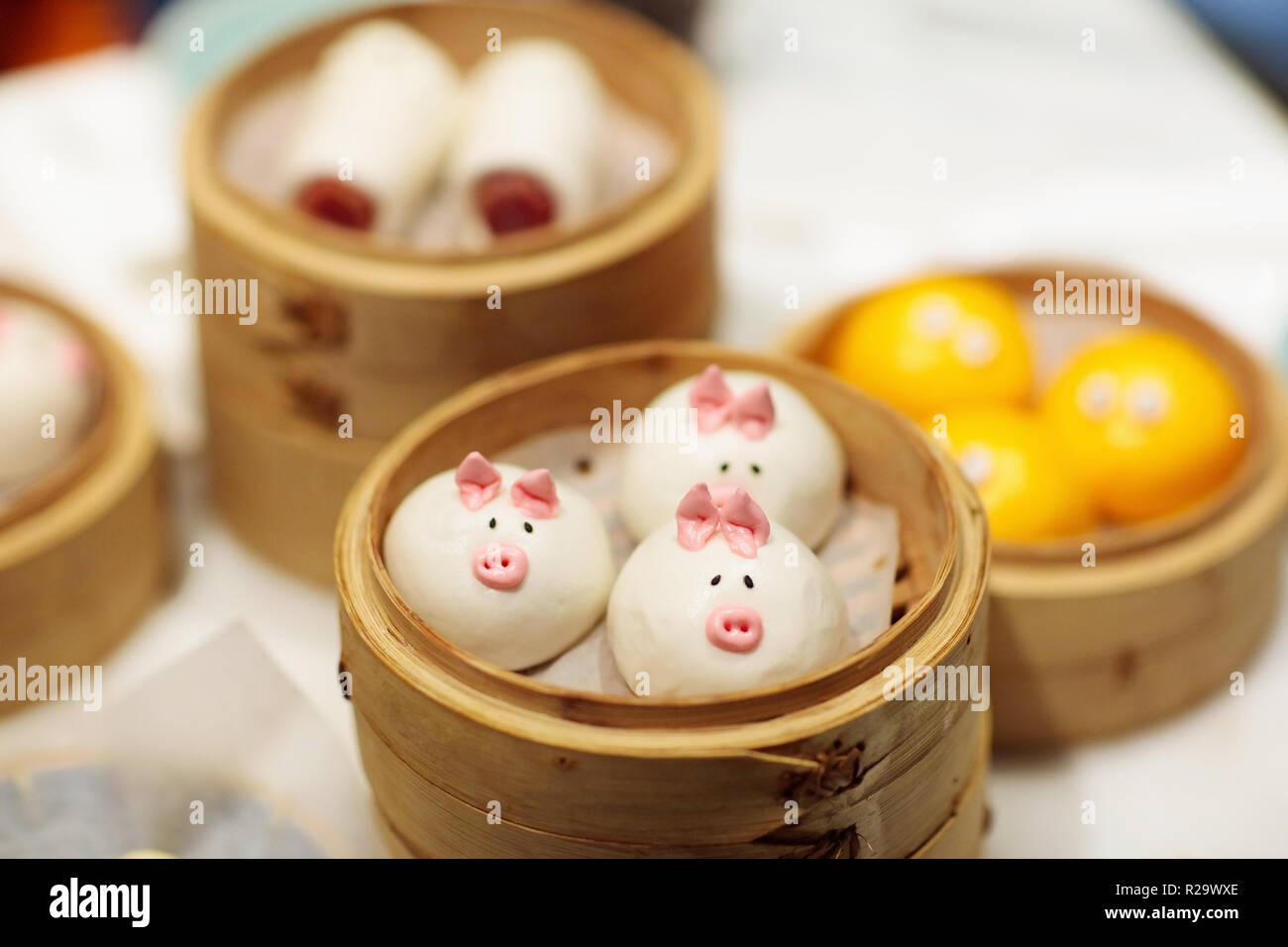 Dim sum, traditional Chinese dumpling in bamboo steamer, pig and animal ...