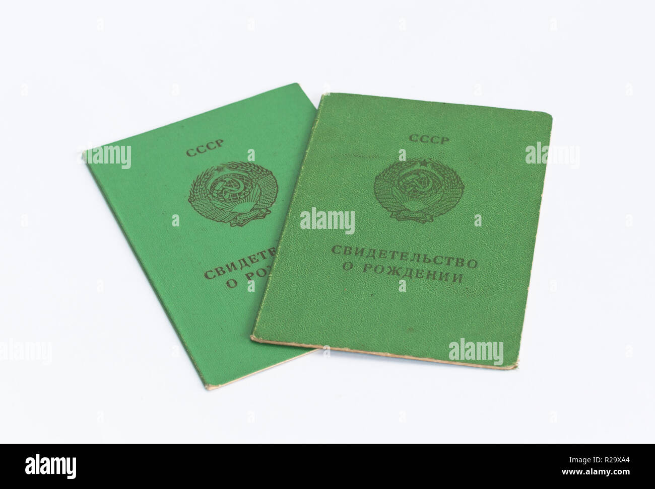 Green USSR birth certificate on white background. Soviet Uniion blazon ...