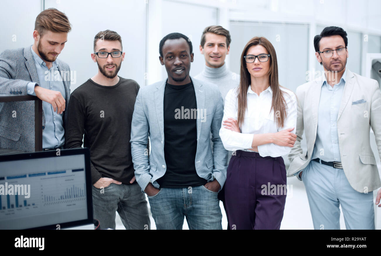group of employees standing in the office Stock Photo - Alamy