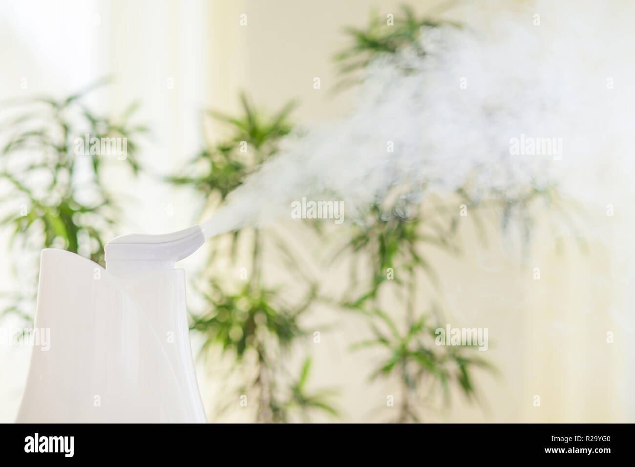 Humidifier spreading steam into the living room Stock Photo - Alamy